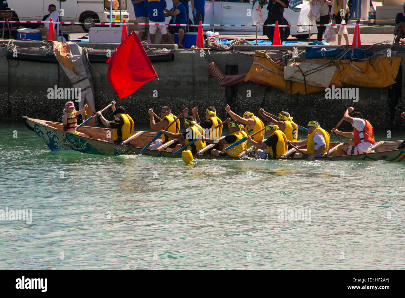 The Camp Kinser dragon boat team rounds the final turn during their ...