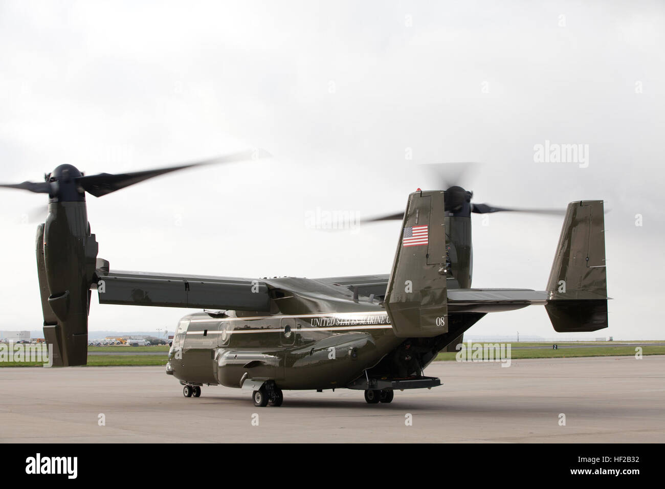 A U.S. Marine Corps MV-22 Osprey tilt-rotor aircraft sits on the flight ...