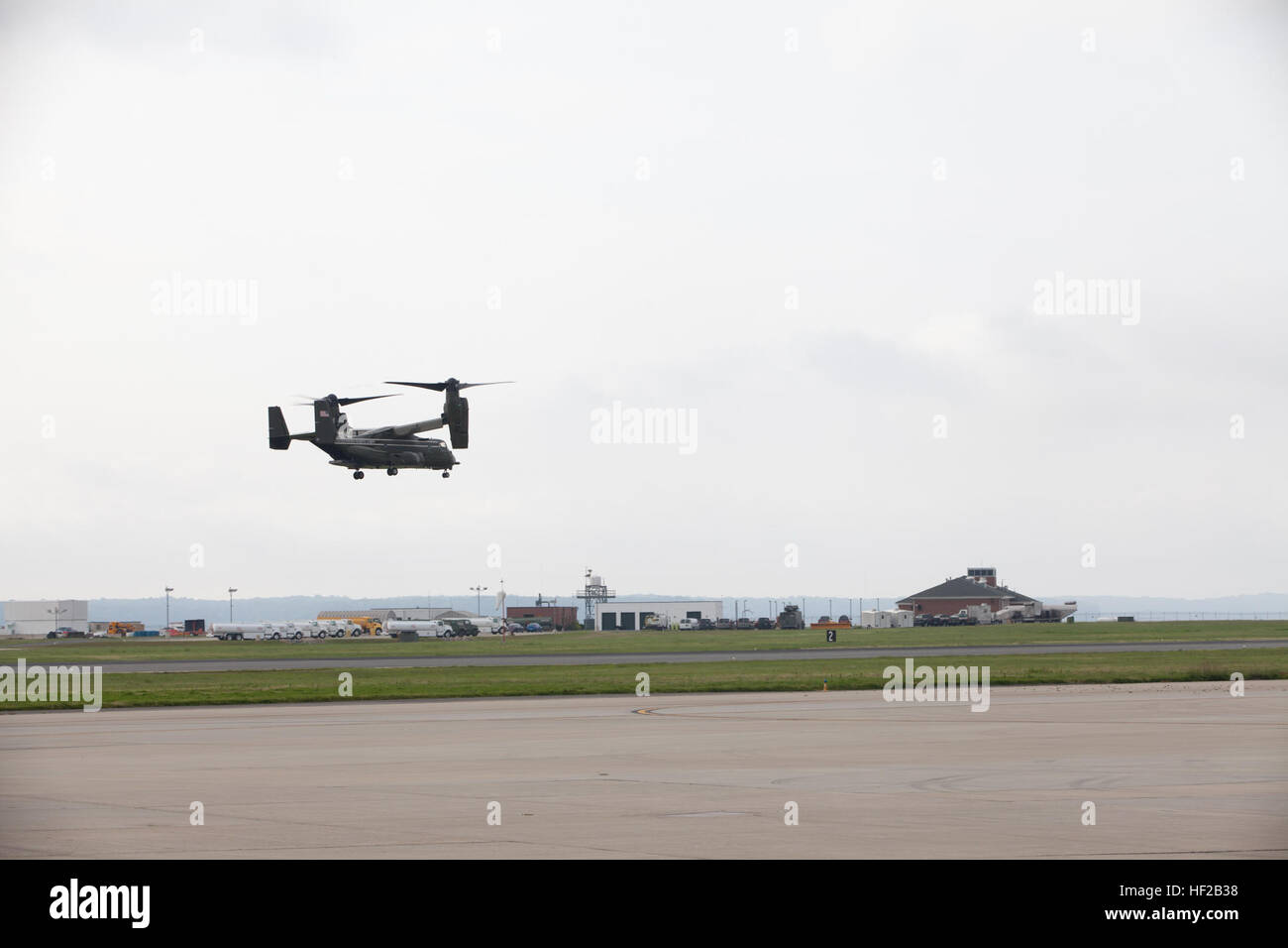 A U.S. Marine Corps MV-22 Osprey tilt-rotor aircraft sits on the flight ...