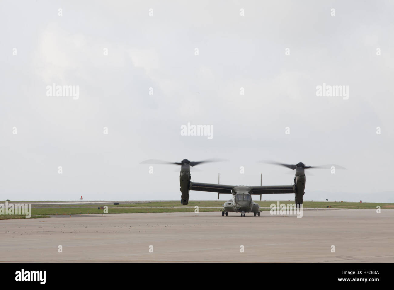 A U.S. Marine Corps MV-22 Osprey tilt-rotor aircraft sits on the flight ...