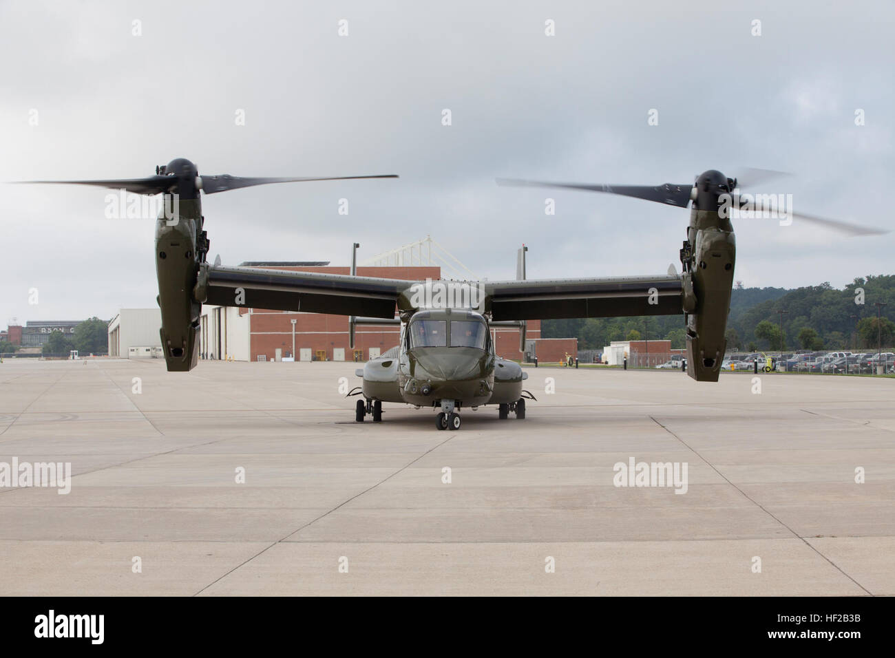 A U.S. Marine Corps MV-22 Osprey tilt-rotor aircraft sits on the flight ...