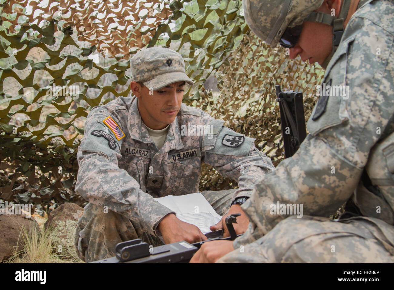A soldier grades a candidate on an Expert Infantry Badge skill at Camp ...
