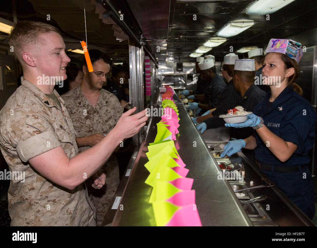 U.S. Navy Sailors aboard the amphibious transport dock ship USS Mesa ...