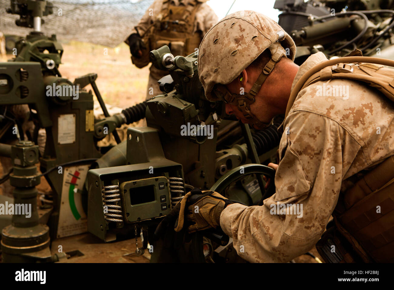 U.S. Marine Corps Lance Cpl. Christopher Hess, a field artillery fire ...