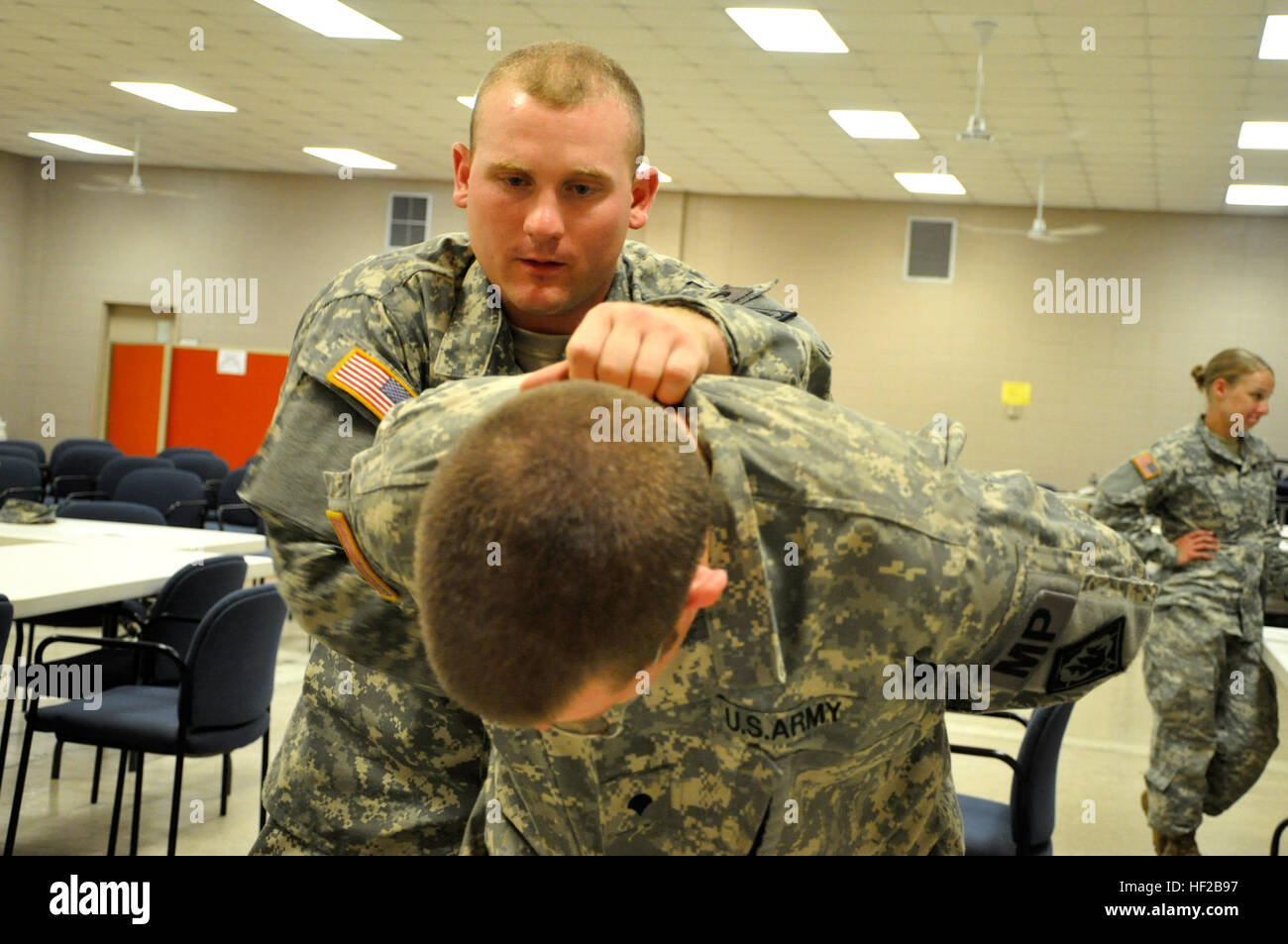 Second Lt. Joseph Yonko of Flowood, Miss., searches a detainee in the ...