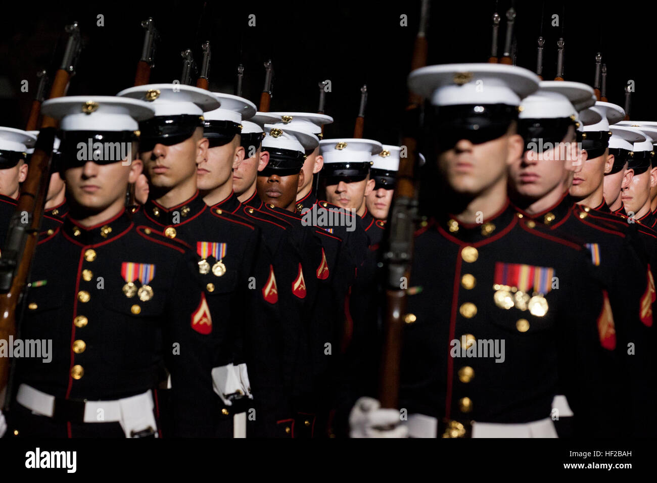 U.S. Marines march in a pass in review during an Evening Parade at ...