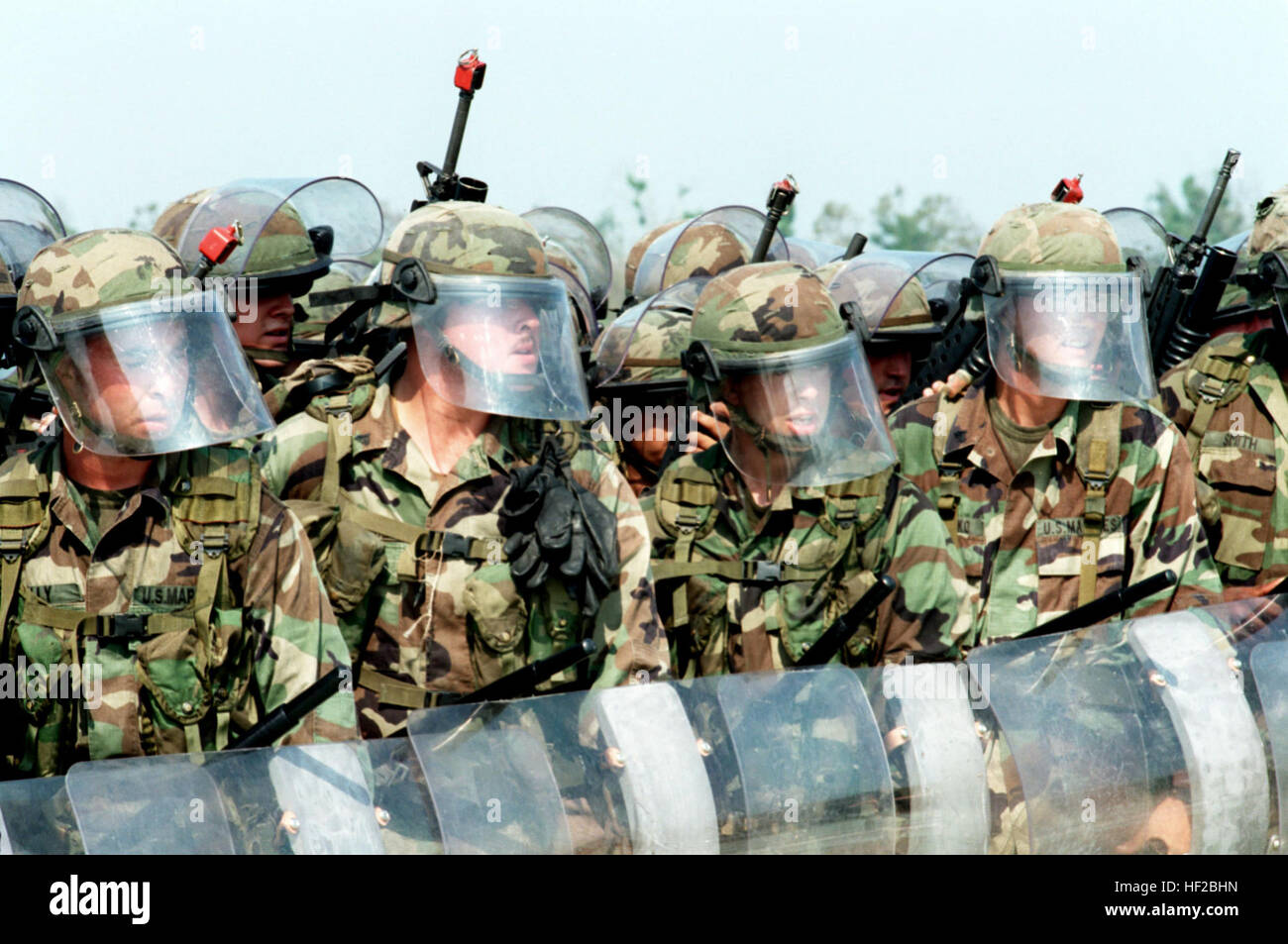 980604-M-2374T-015 U.S. Marines in riot gear build a human wall as they ...