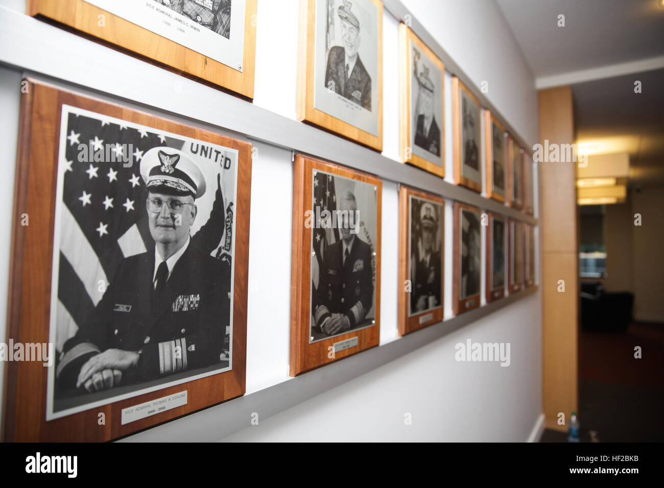 Portraits of past U.S. Coast Guard leaders hang on a wall during a ...