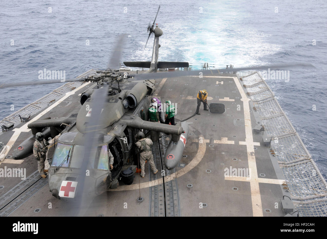 Crew members of the Oliver Hazard Perry-class guided-missile frigate ...