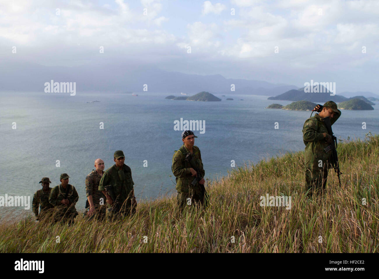 Brazilian Marines track a simulated enemy up a mountain during a bi ...