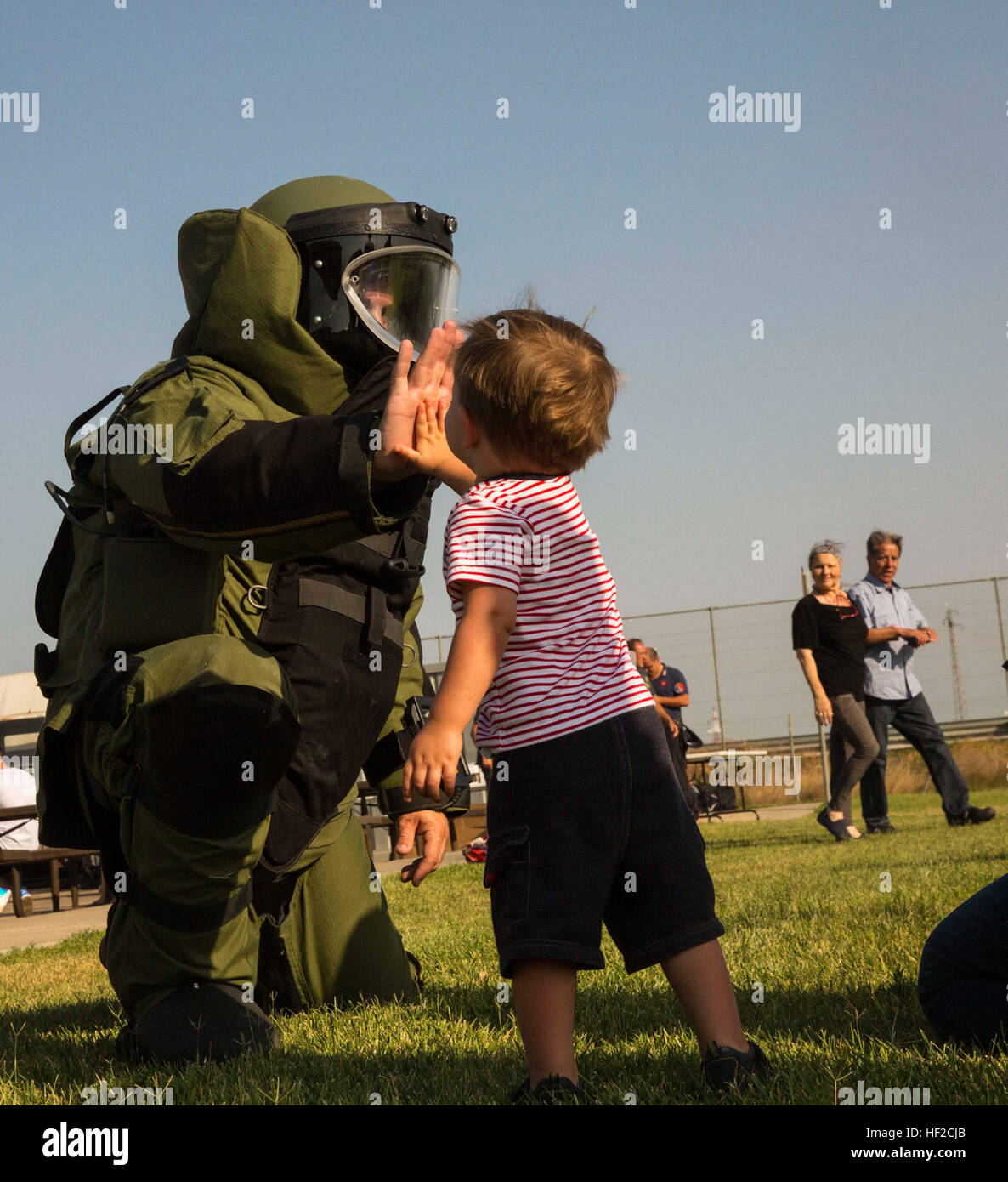A Marine with the second iteration of SP-MAGTF Africa 14 gives a child ...