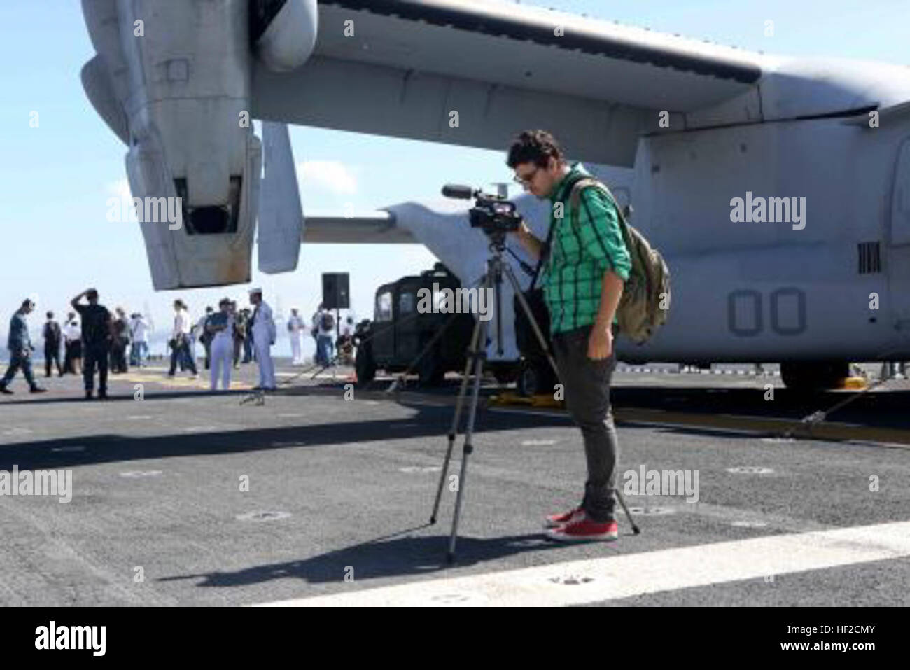 A member of the Brazilian media records footage of an MV-22 Osprey ...