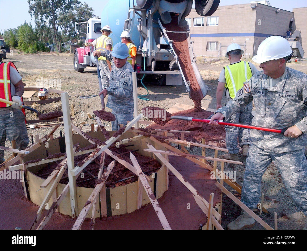 Staff Sgt. Cedric Daga, center, supply sergeant for Headquarters and ...
