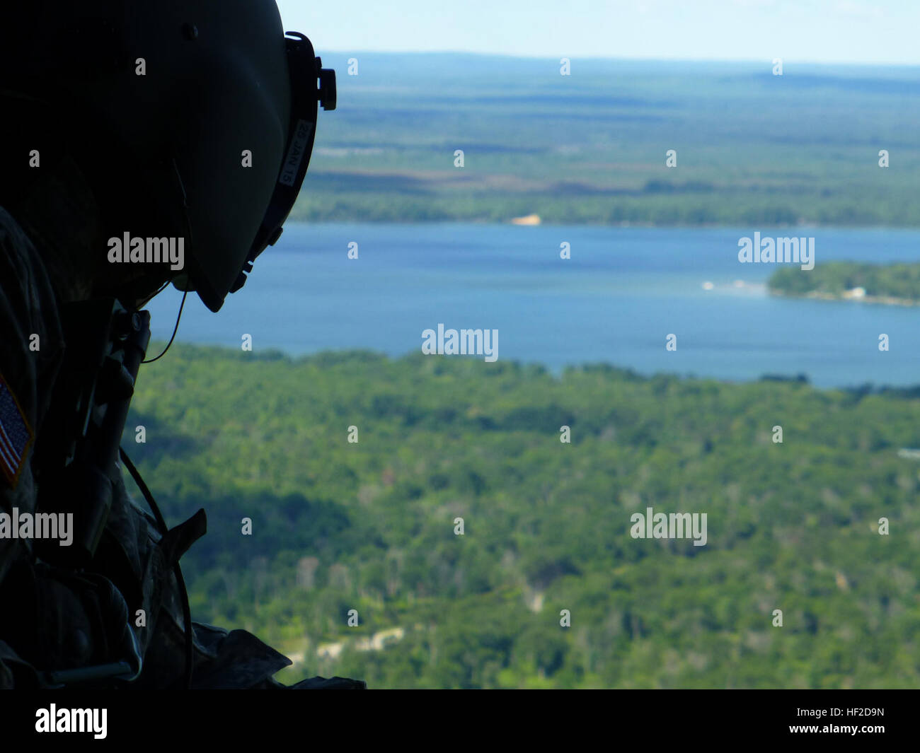 The crew chief of a CH-47 Chinook helicopter scans the Grayling, Mich ...