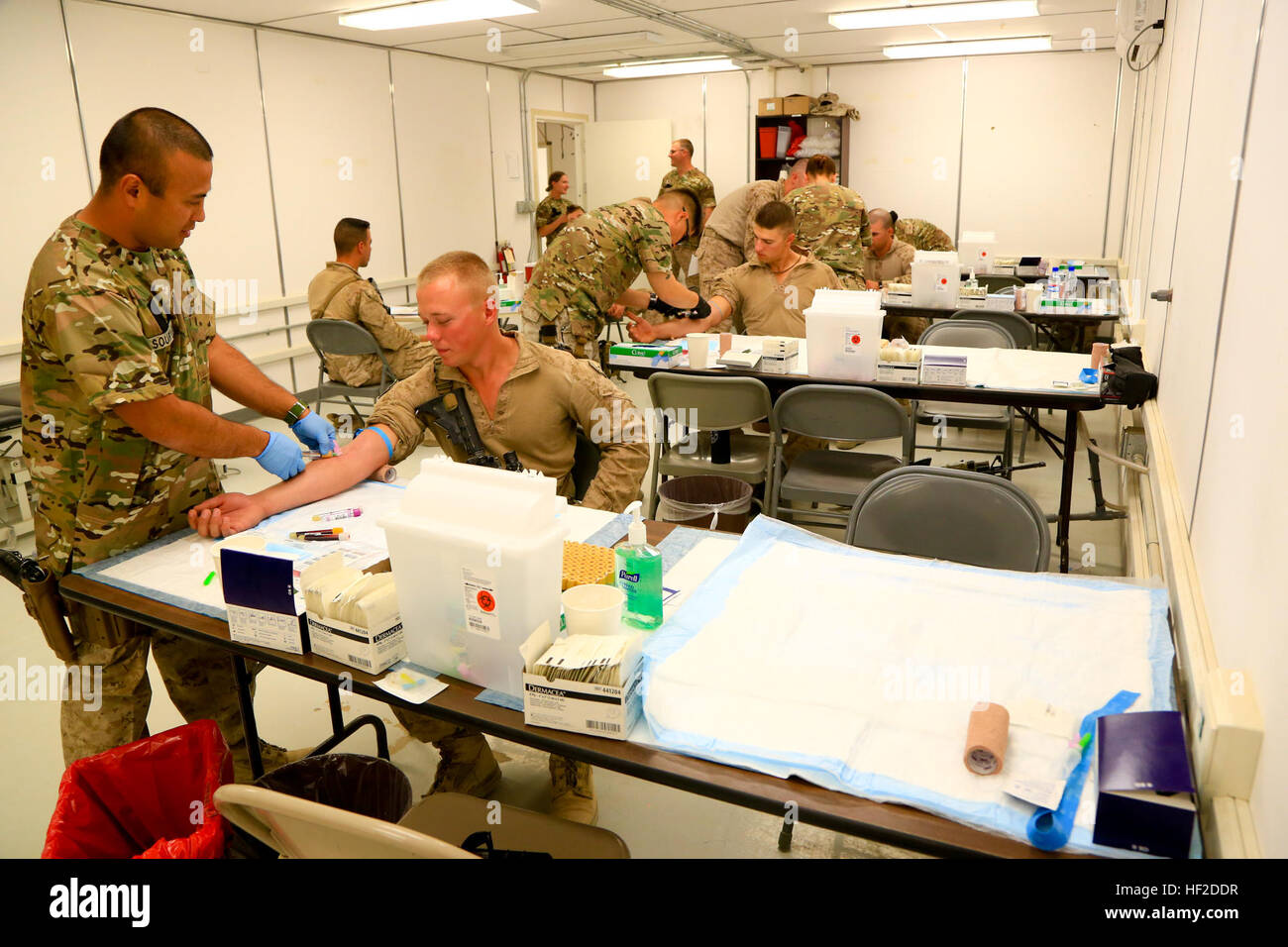 U.S. Sailors with Combat Logistics Battalion 1, draw blood from U.S ...