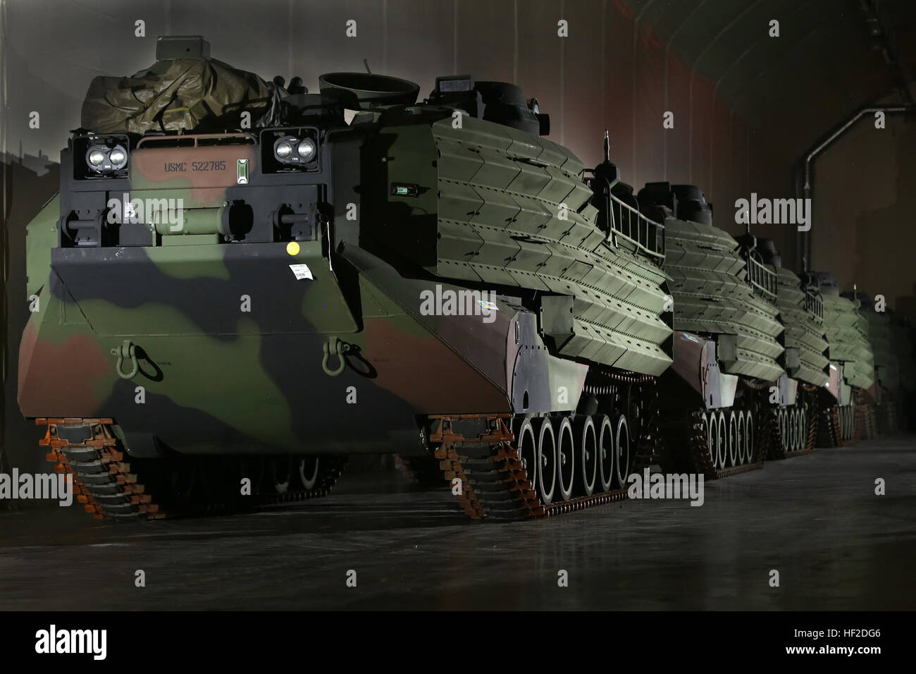 Marine Corps Amphibious Assault Vehicles are staged inside one of the ...