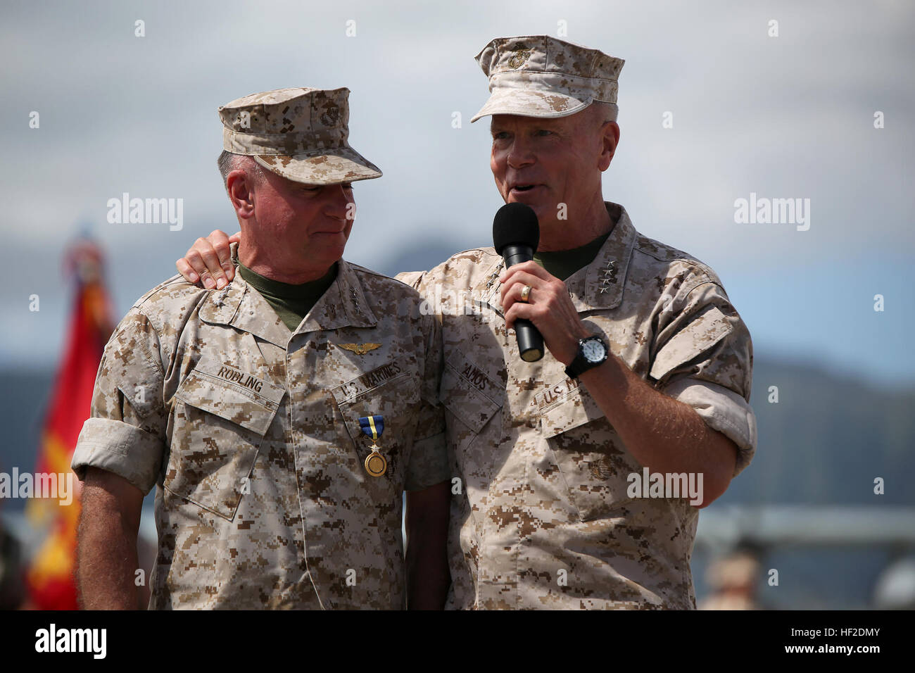 Gen. James F. Amos, commandant of the Marine Corps (right), speaks ...