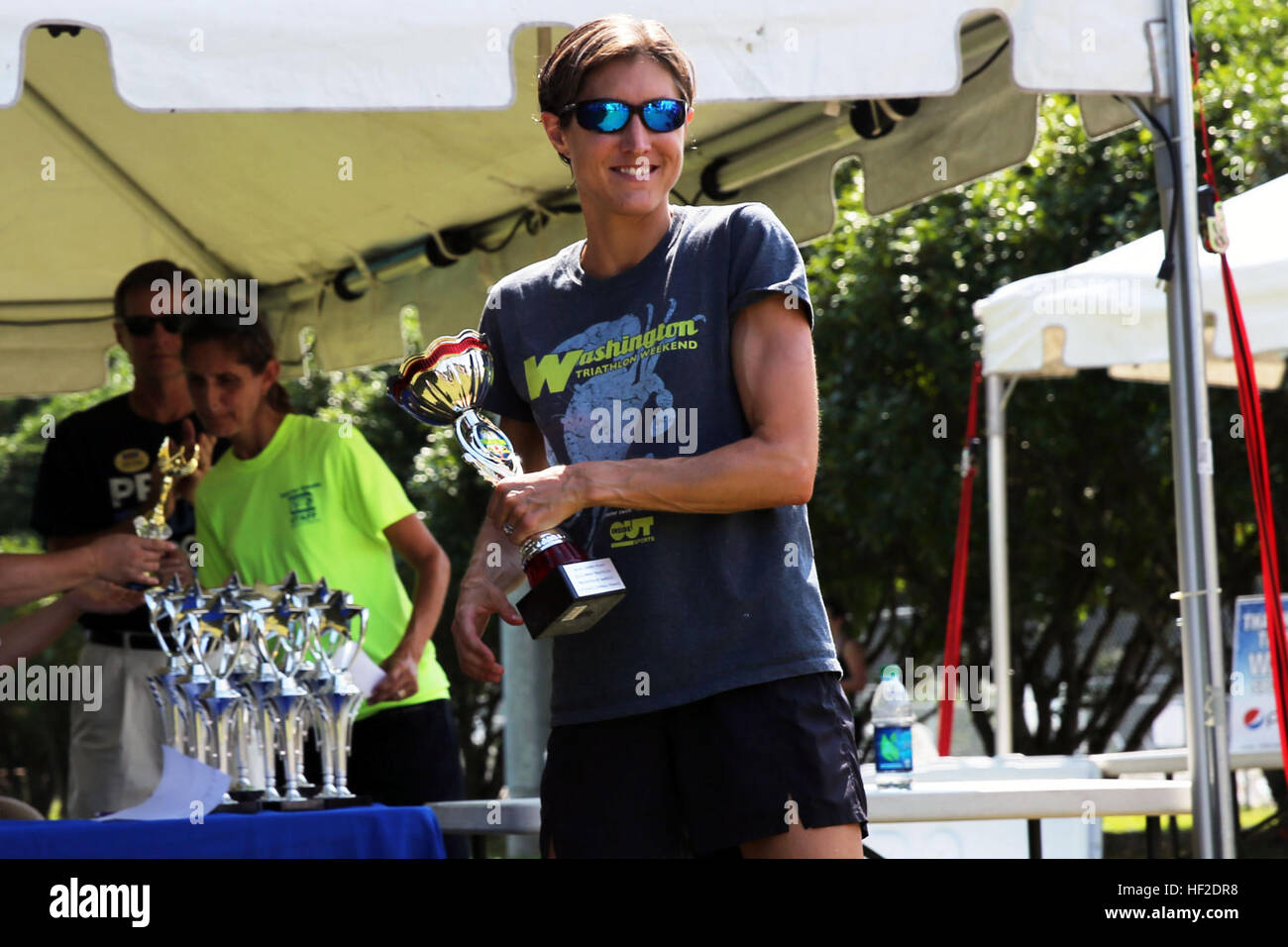 Andrea Packard claims the female first place trophy after finishing ...