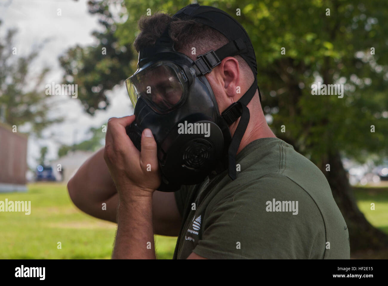 A U.S. Marine with 2d Marine Logistics Group (2D MLG) puts on the M50 ...