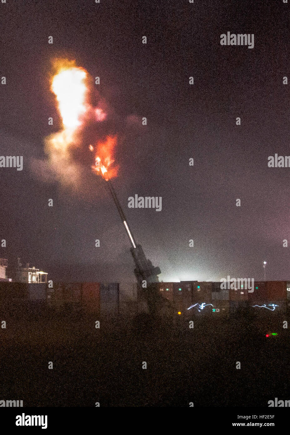 An illumination round is fired from an M777A2 howitzer from Kandahar ...