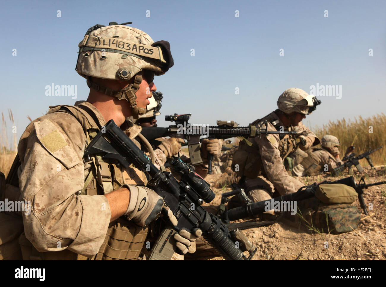 U.S. Marines take a defensive position during a firefight in Marjah ...
