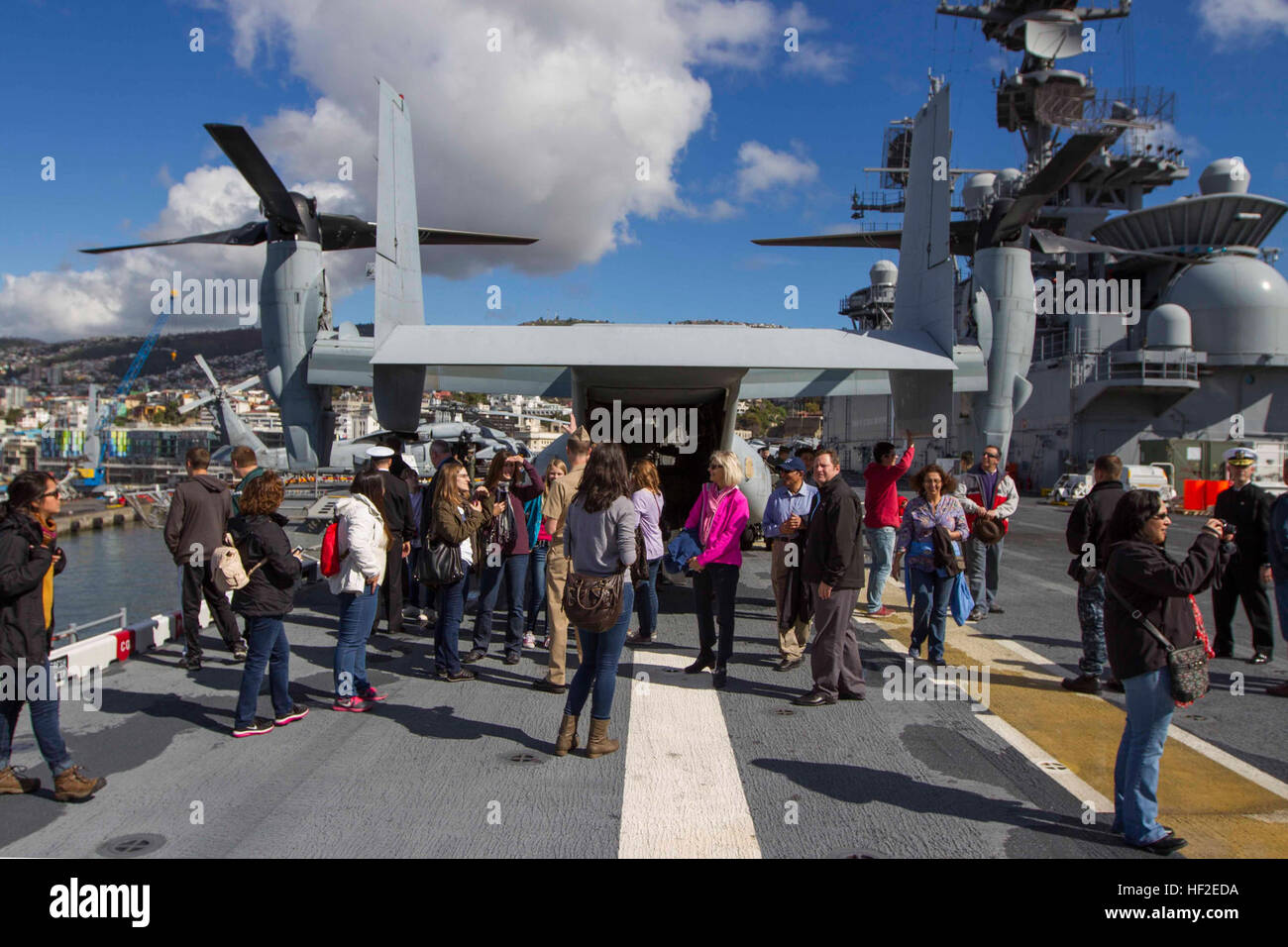 U.S. Embassy staff and their families gather around a static display of ...