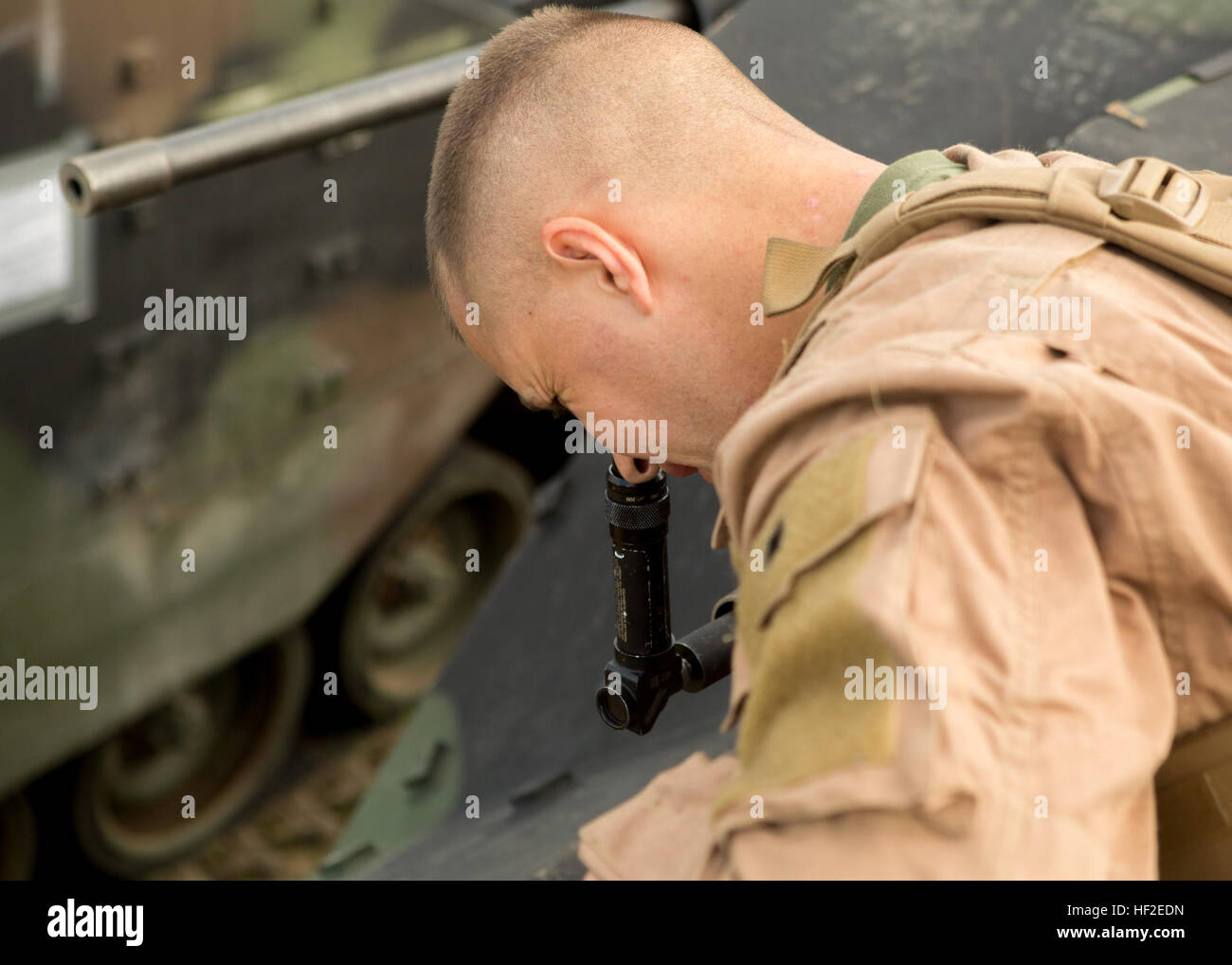 Lance Cpl. Tyler Bears, AAV7A1 tracked vehicle Crewman, bore sights the ...