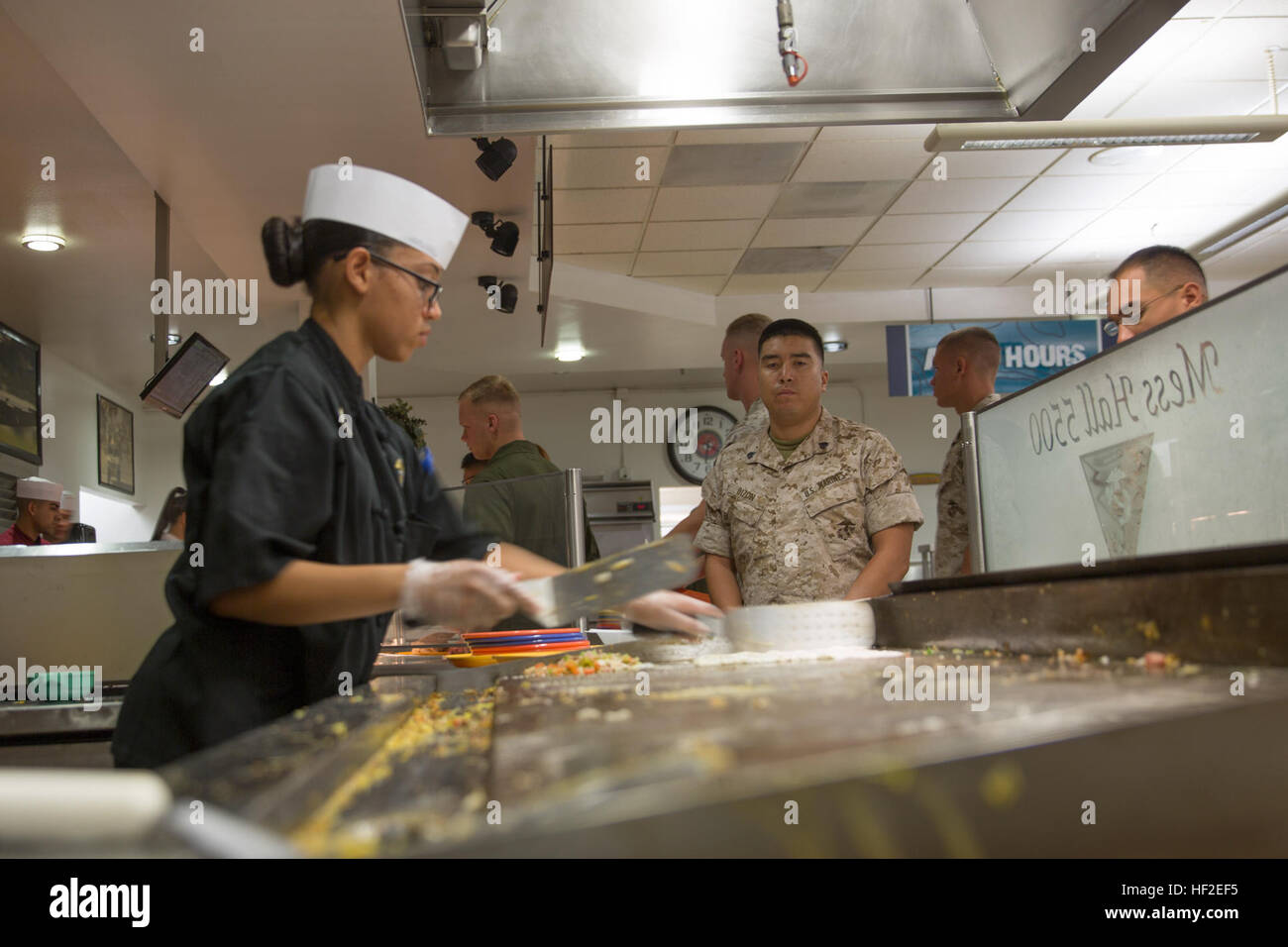 Pfc. Raquel Garcia, a food service technician at Gonzales Hall, cooks ...