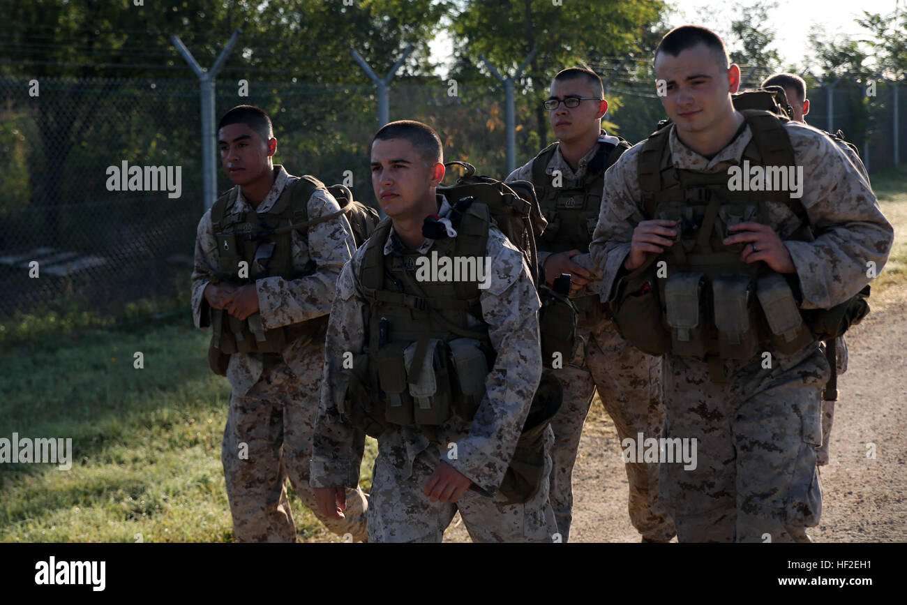 U.S. Marines with Golf Company, 2nd Battalion, 2nd Marine Regiment participate in a 10-mile hike ...