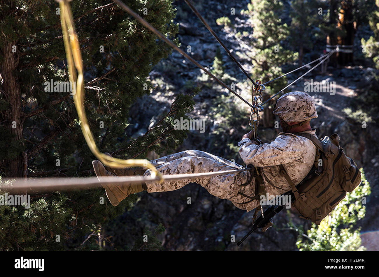 U.S. Marine 2nd Lt. Hunter Harrison makes his way across a gorge ...