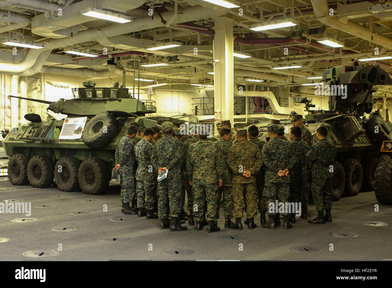 Peruvian Marines gather around light armored vehicles at a static ...