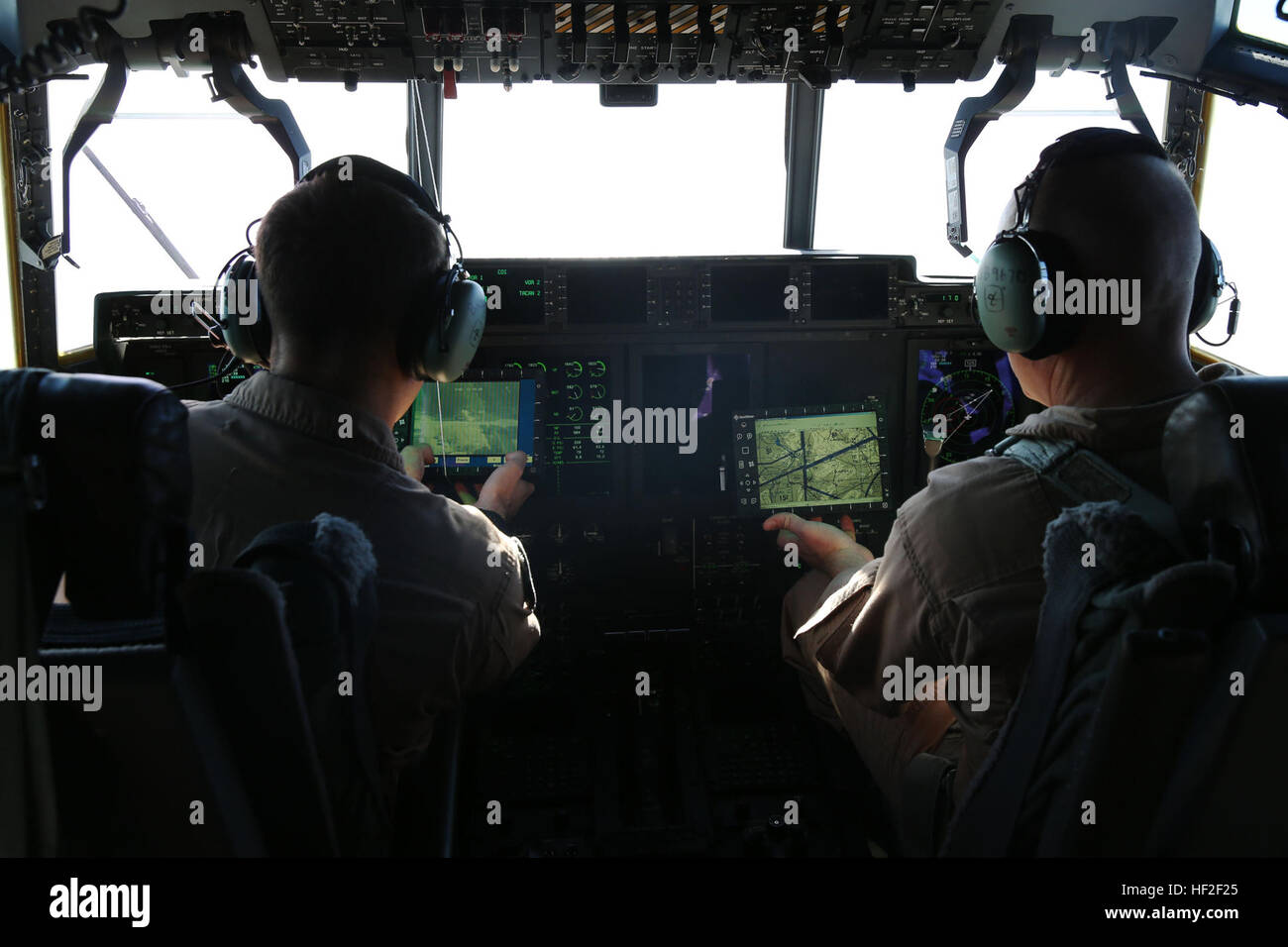 Capt. James Brophy, left, and 1st Lt. David Bick fly a modified KC-130J ...