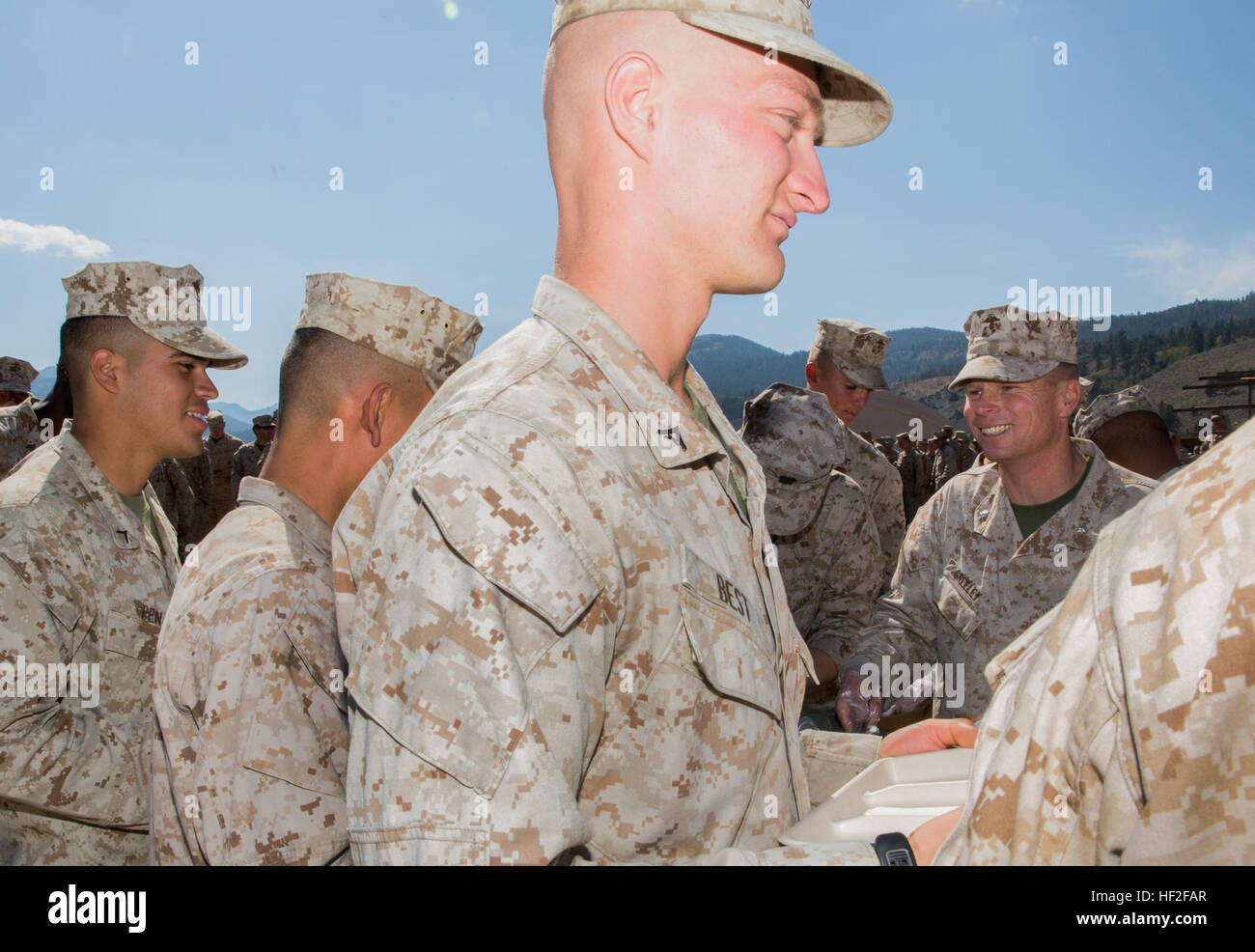 U.S. Marine Lt. Col. Edward Greeley serves his Marines dinner during a ...