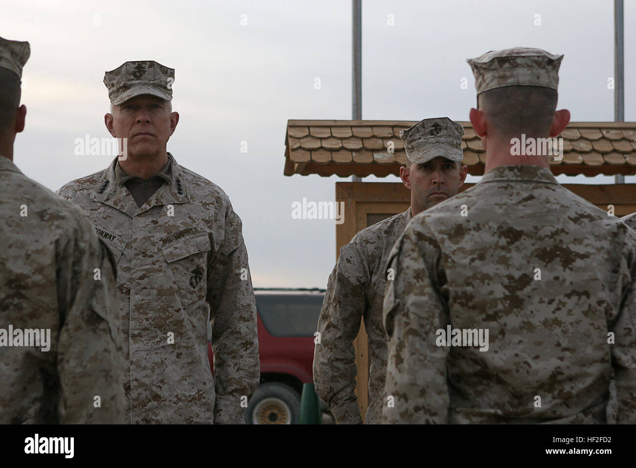 Gen. James T. Conway (left) and Lt. Col. David L. Odom (right) stand at ...