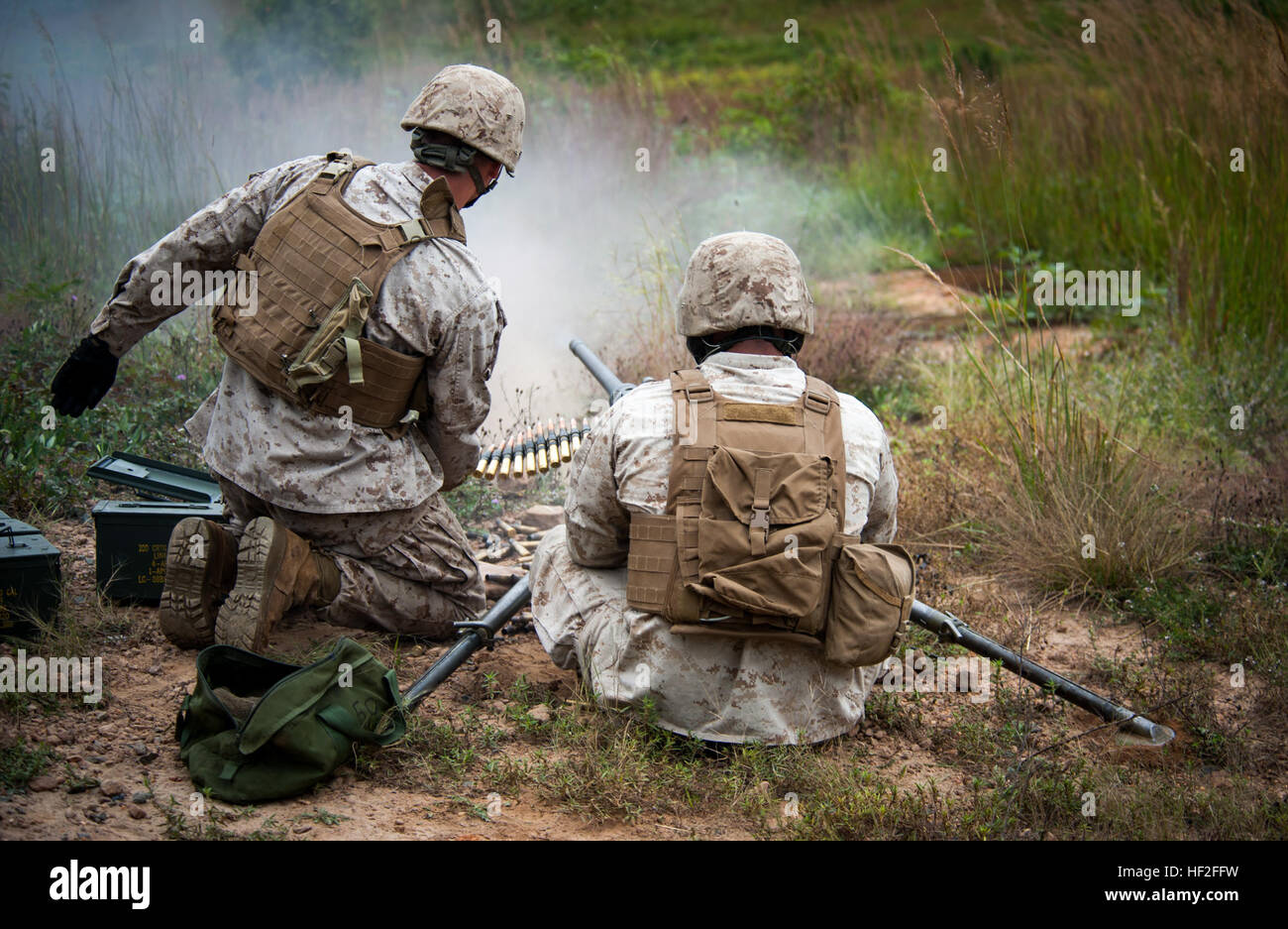 U.S. Marine Corps Cpl. James McCarthy, right, a machine gunner with the ...
