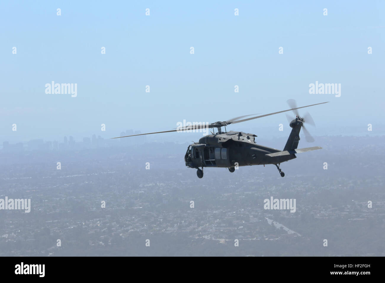 A UH-60L Black Hawk flies over San Diego after completing a live-fire ...