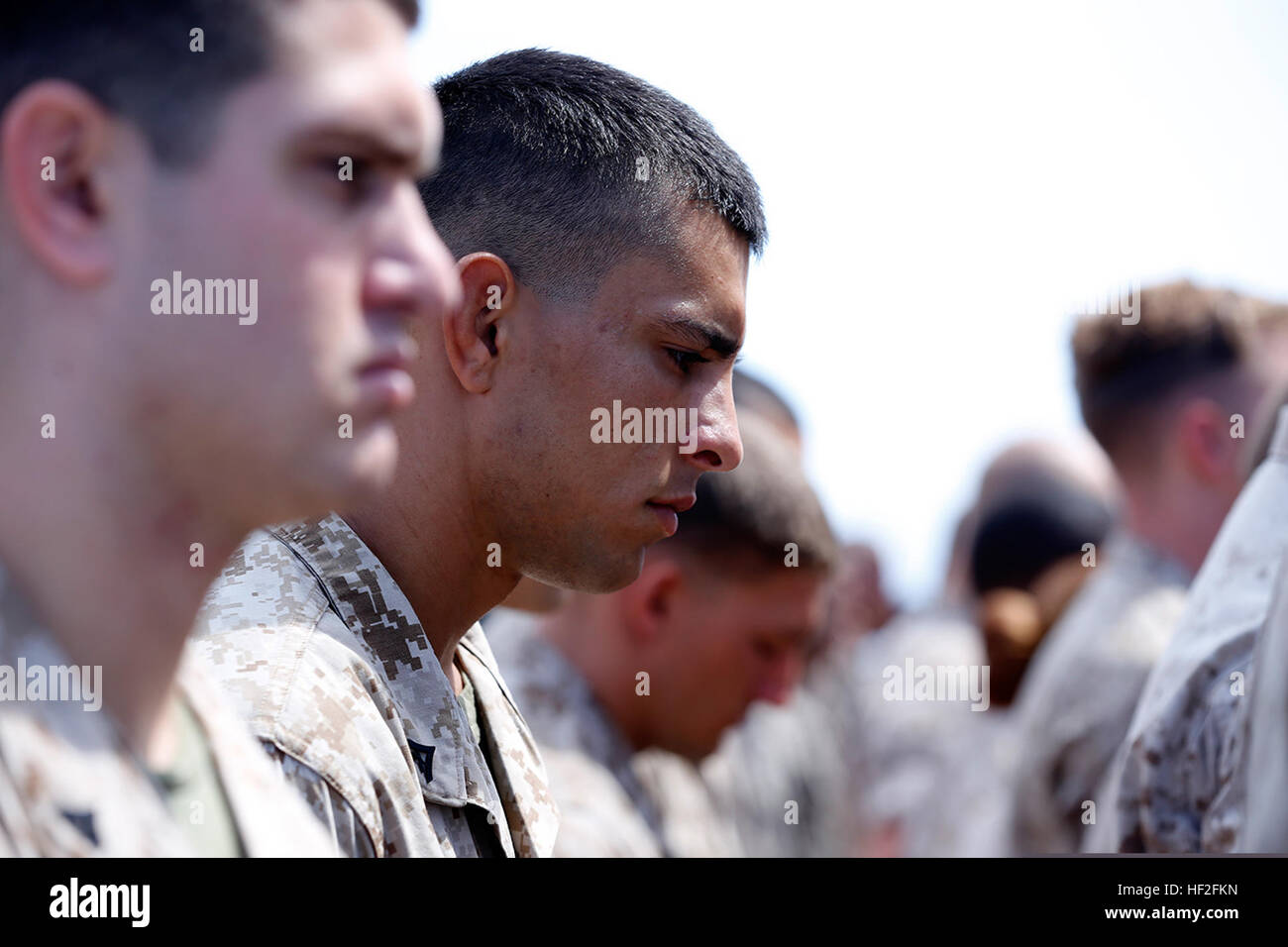 U.S. Marines with the 11th Marine Expeditionary Unit bow their heads ...