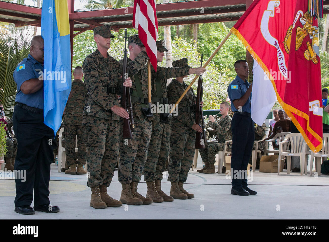 U.S. Marines and Palauan police officers present colors during the 70th ...