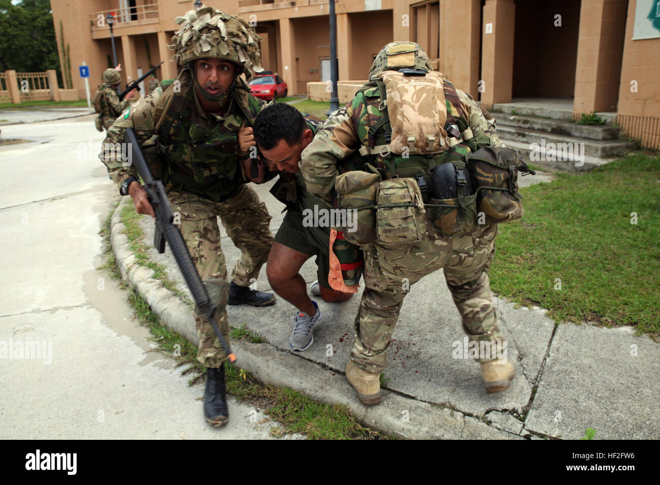 British Lance Cpl. Dhilushka U. Maheswaran (left), a military ...