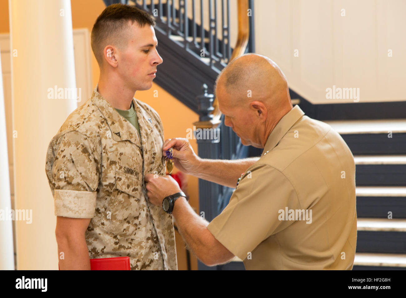 Lt. Gen. Robert B. Neller presents a Purple Heart medal to Lance ...