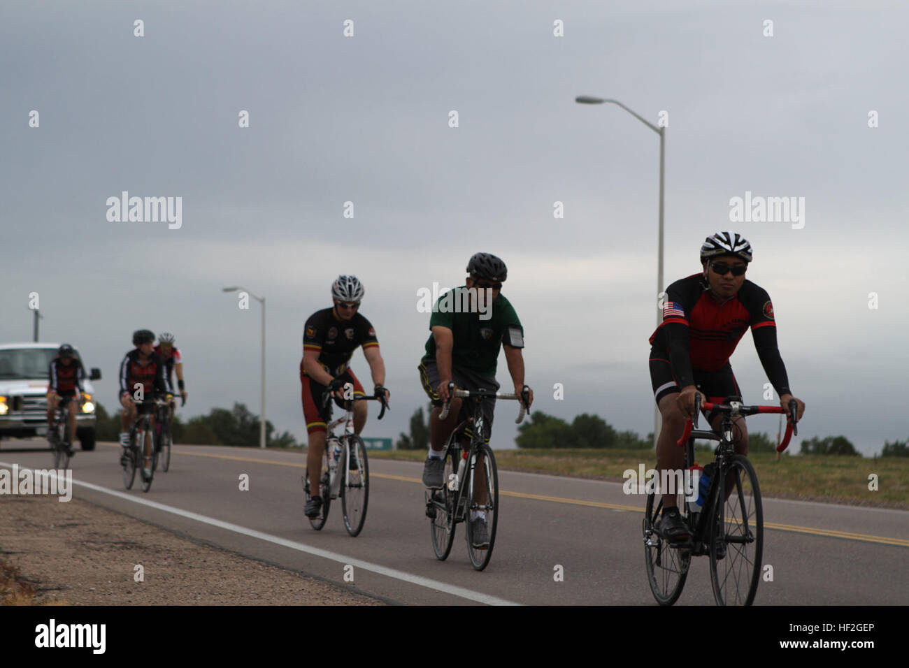 Members of the Marine team head down the road during cycling practice ...