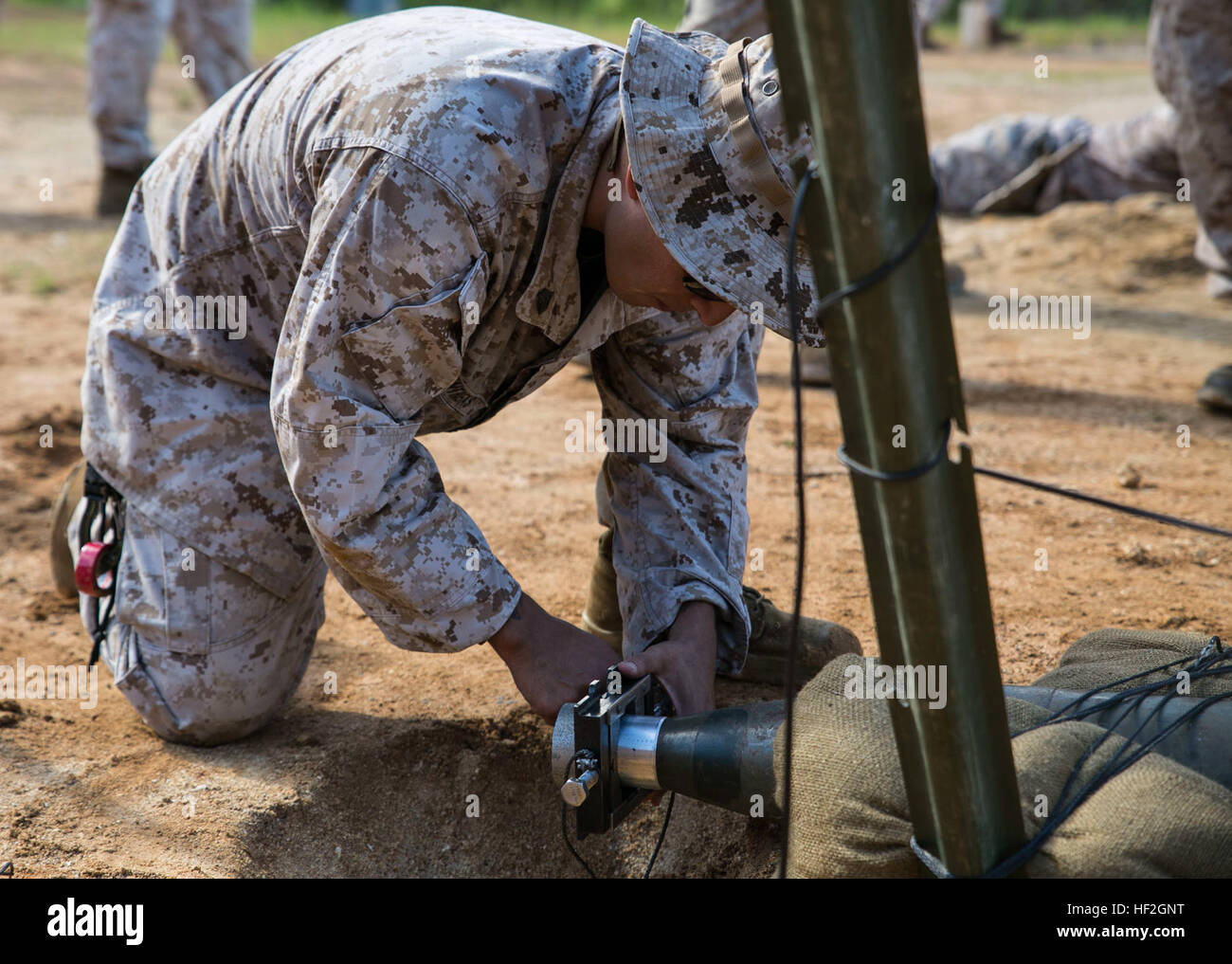 Sgt. Jesus Contreras, from Fabens, Texas, makes fine adjustments to a ...