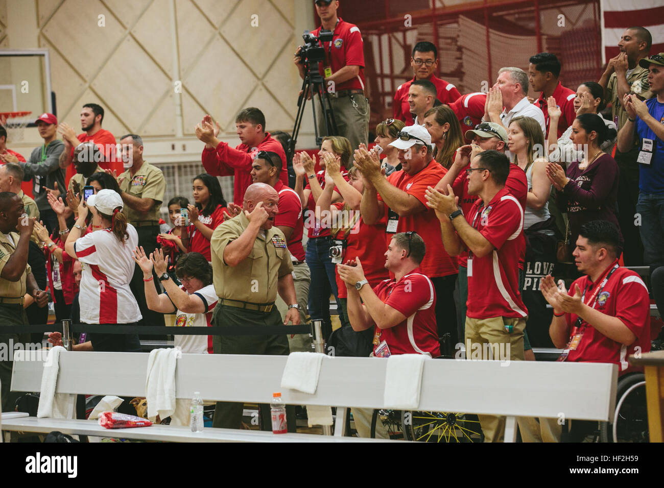 Fans cheer on the Warrior Games All-Marine Team in sitting volleyball ...