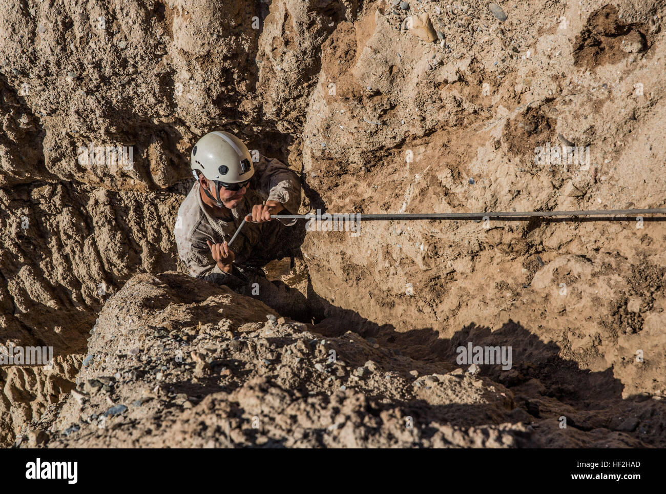 U.S. Marine Cpl. Oai Tran simulates assaulting a beach with steep earth ...