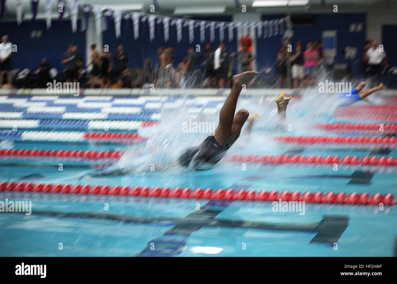 Sgt. Alex Nguyen from Fremont, Nebraska, takes off for the 50-meter ...
