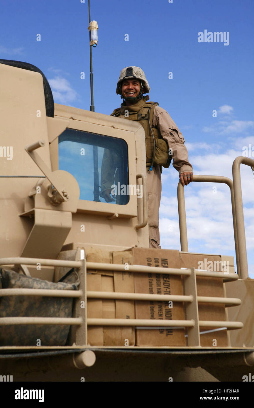 Sgt. John W. Springs stands atop a Buffalo Mine Protected Clearance ...