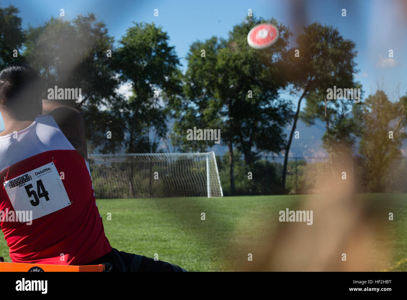 A service member participates in the discus event during the 2014 ...