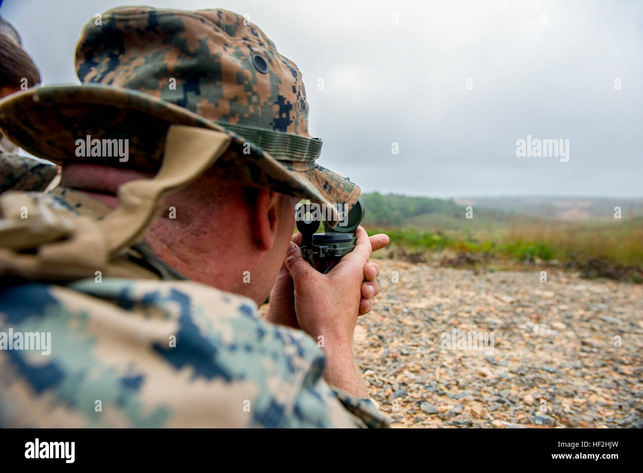 A U.S. Marine assigned to Scout Sniper Basic Course Class 3-14, shoots ...