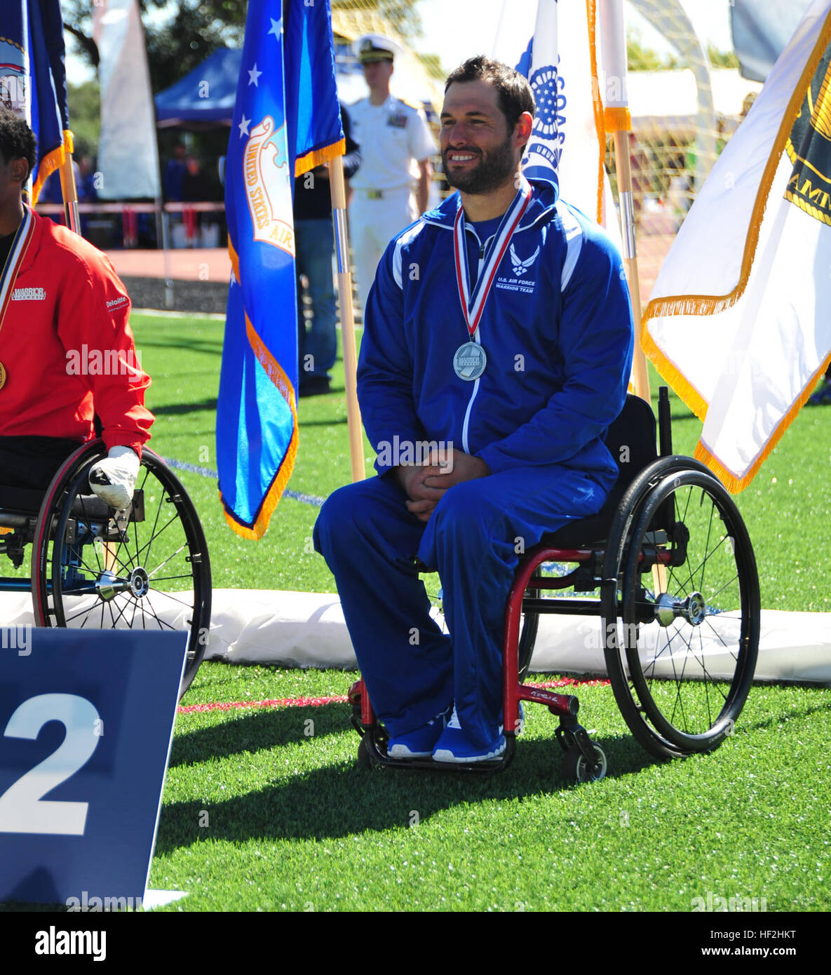 Air Force athlete Ryan Pinney receives the silver medal for the discus ...