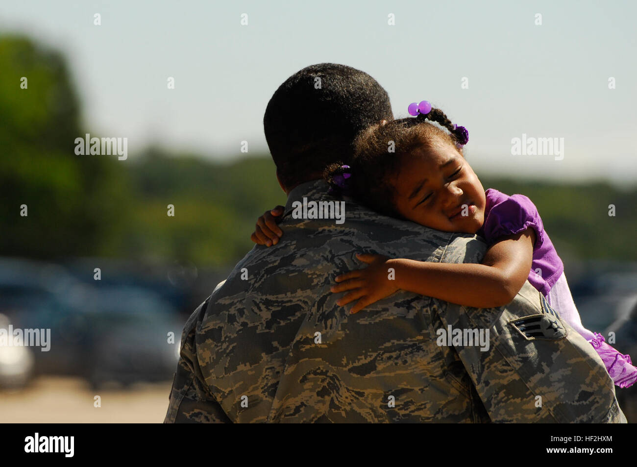 Kaliyah, three, hugs her father U.S. Air Force Senior Airman Damien ...
